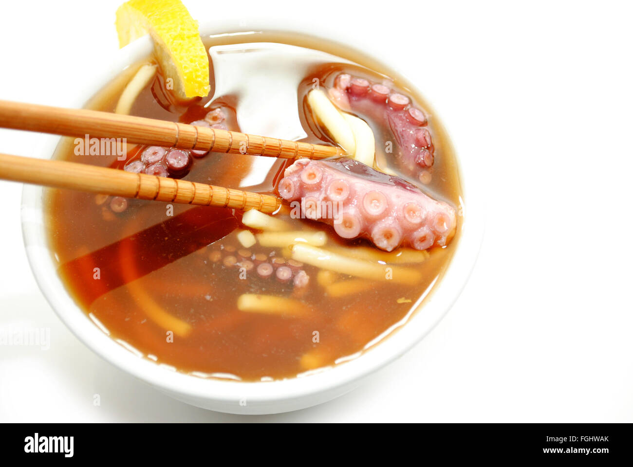 Eating Noodle and Octopus Soup with Chopsticks Stock Photo - Alamy