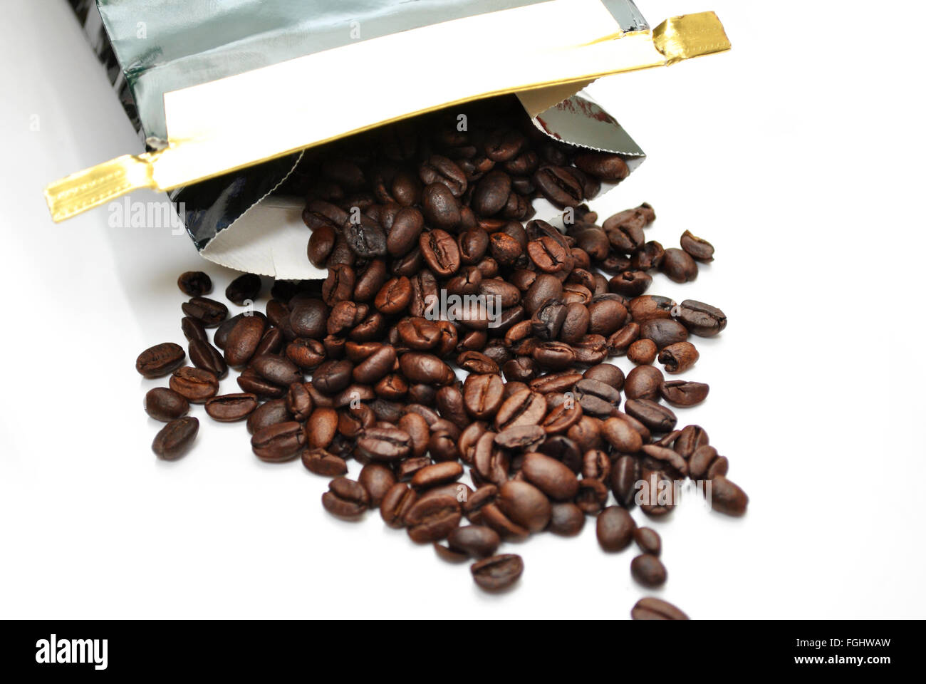 Fresh Coffee Beans Spilling Out of a Bag Stock Photo - Alamy