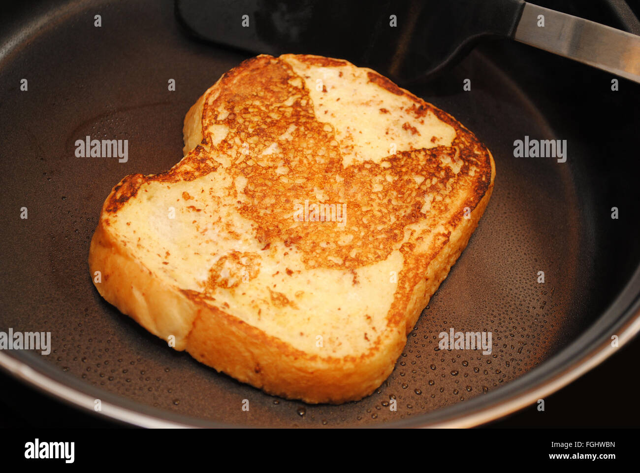 French Toast Cooked in a Black Fry Pan Stock Photo - Alamy