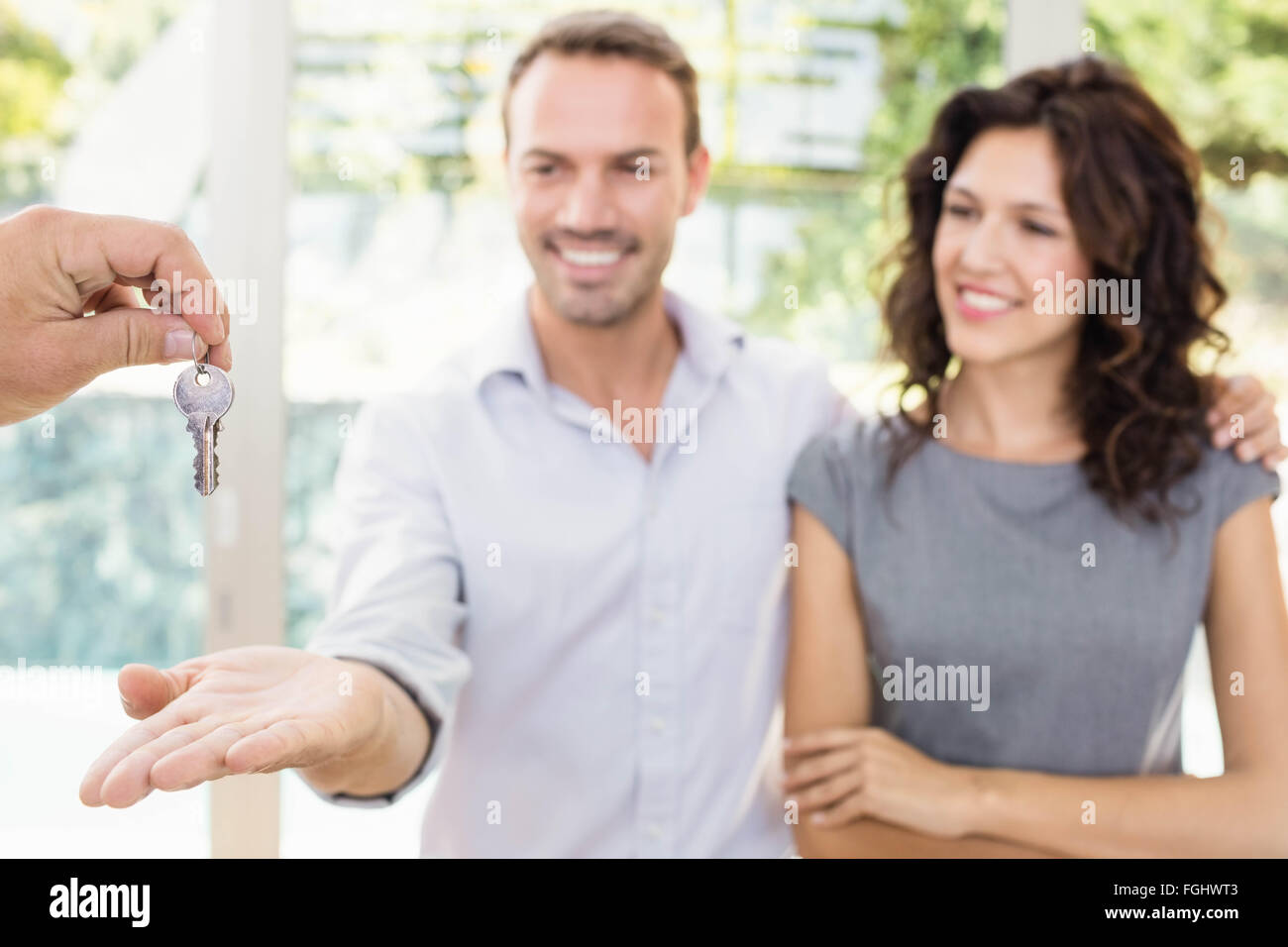 Real-estate agent giving keys Stock Photo - Alamy