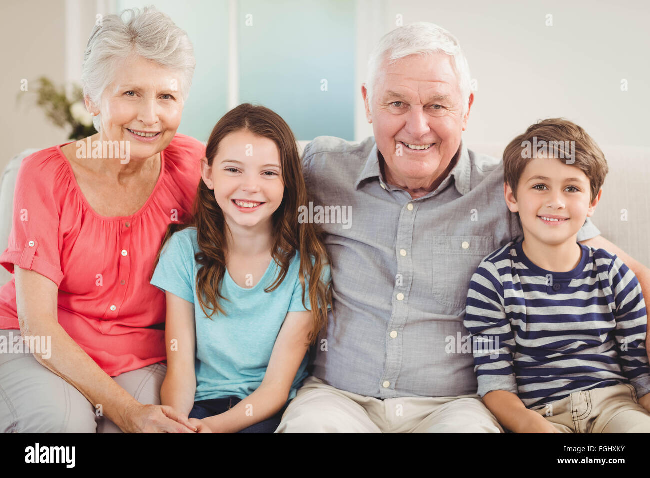 Grandfather with grandchildren sofa hi-res stock photography and images ...
