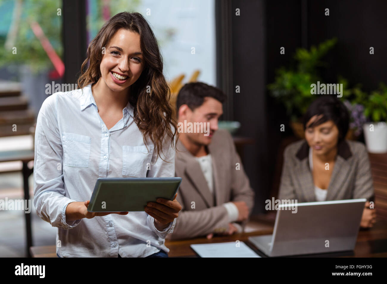 Friends using technology Stock Photo - Alamy