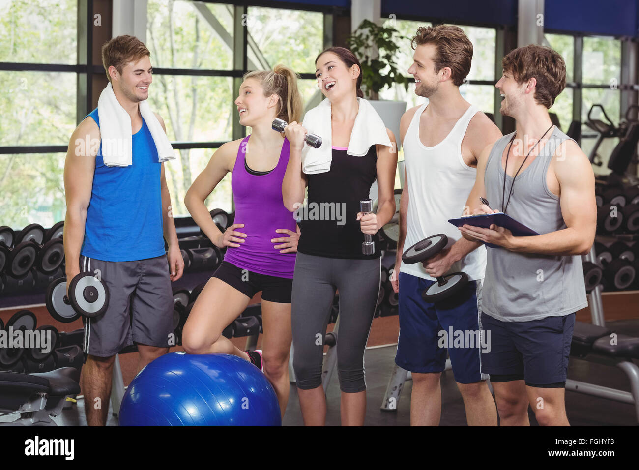 Fit people with sports equipment Stock Photo - Alamy