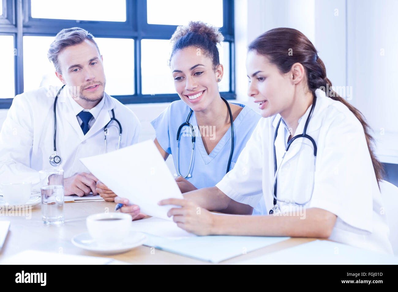 Medical team discussing in meeting Stock Photo - Alamy