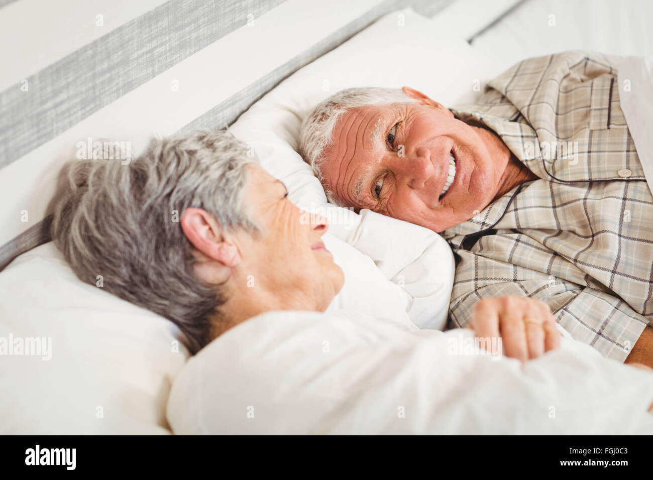 Elderly in bed at home smiling hi-res stock photography and images - Alamy