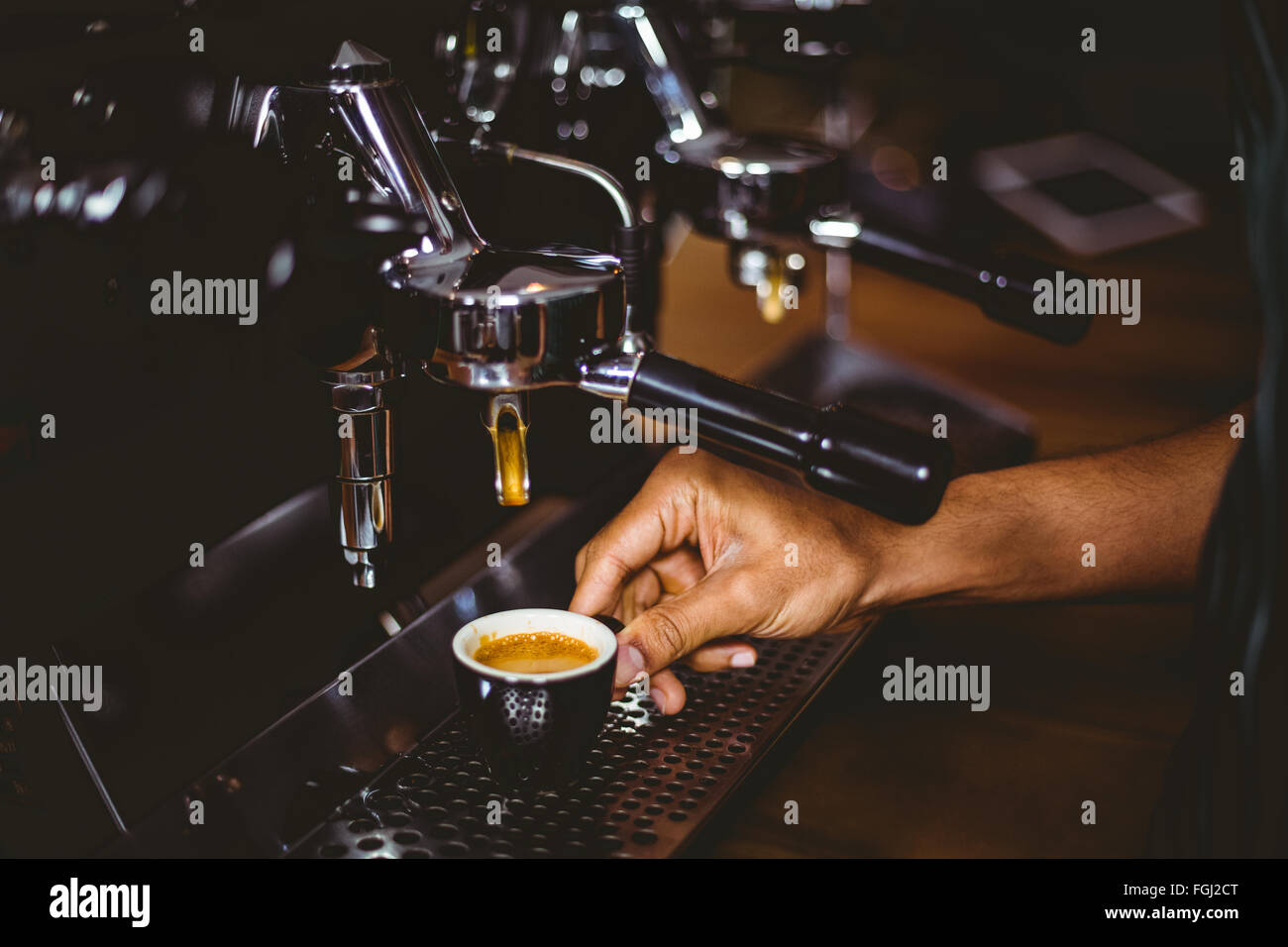 Waiter making a cup of coffee Stock Photo - Alamy