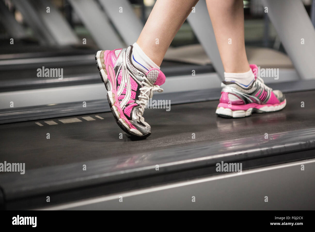 Lower section of a woman on a treadmill Stock Photo - Alamy