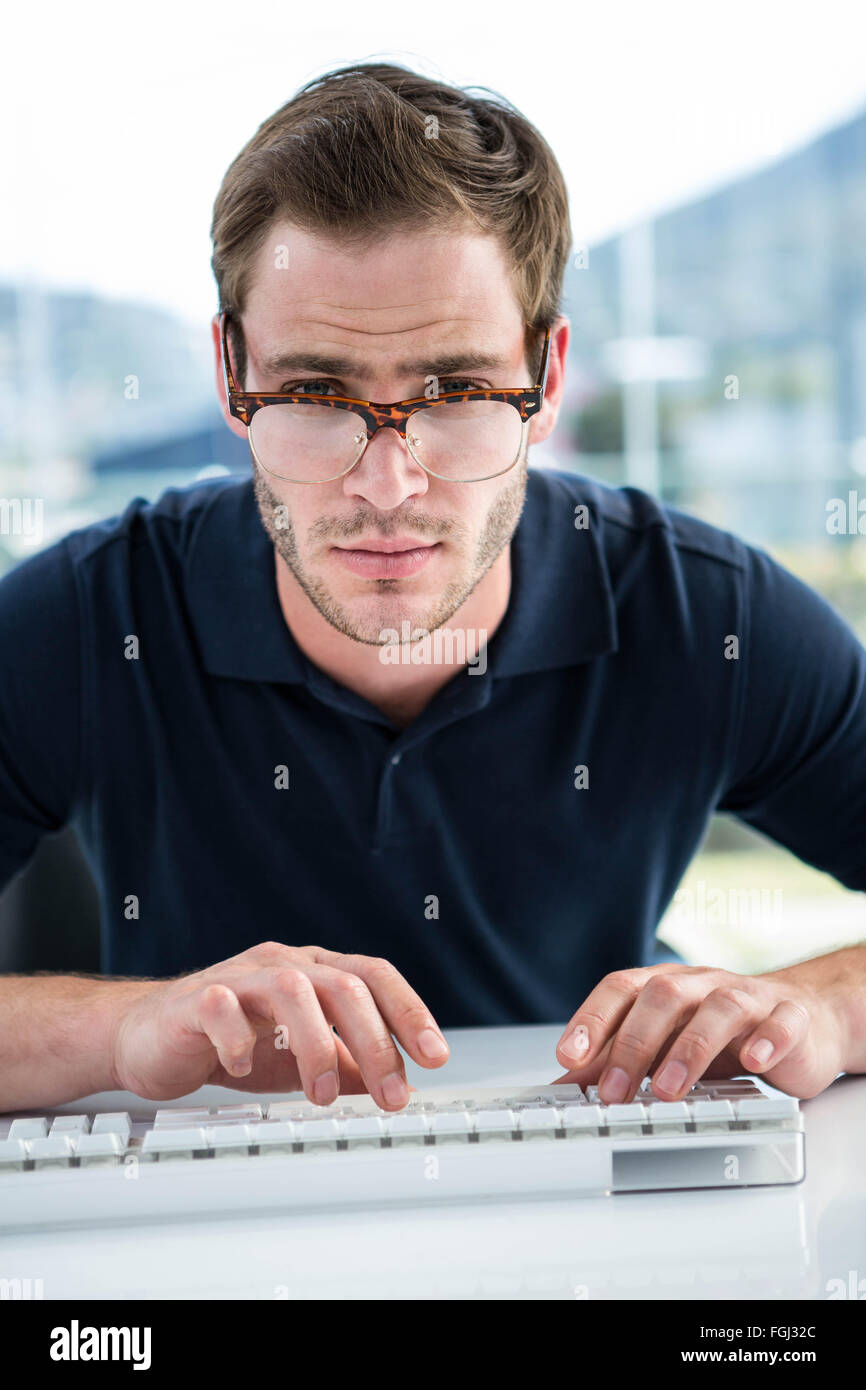 Handsome man using computer Stock Photo - Alamy
