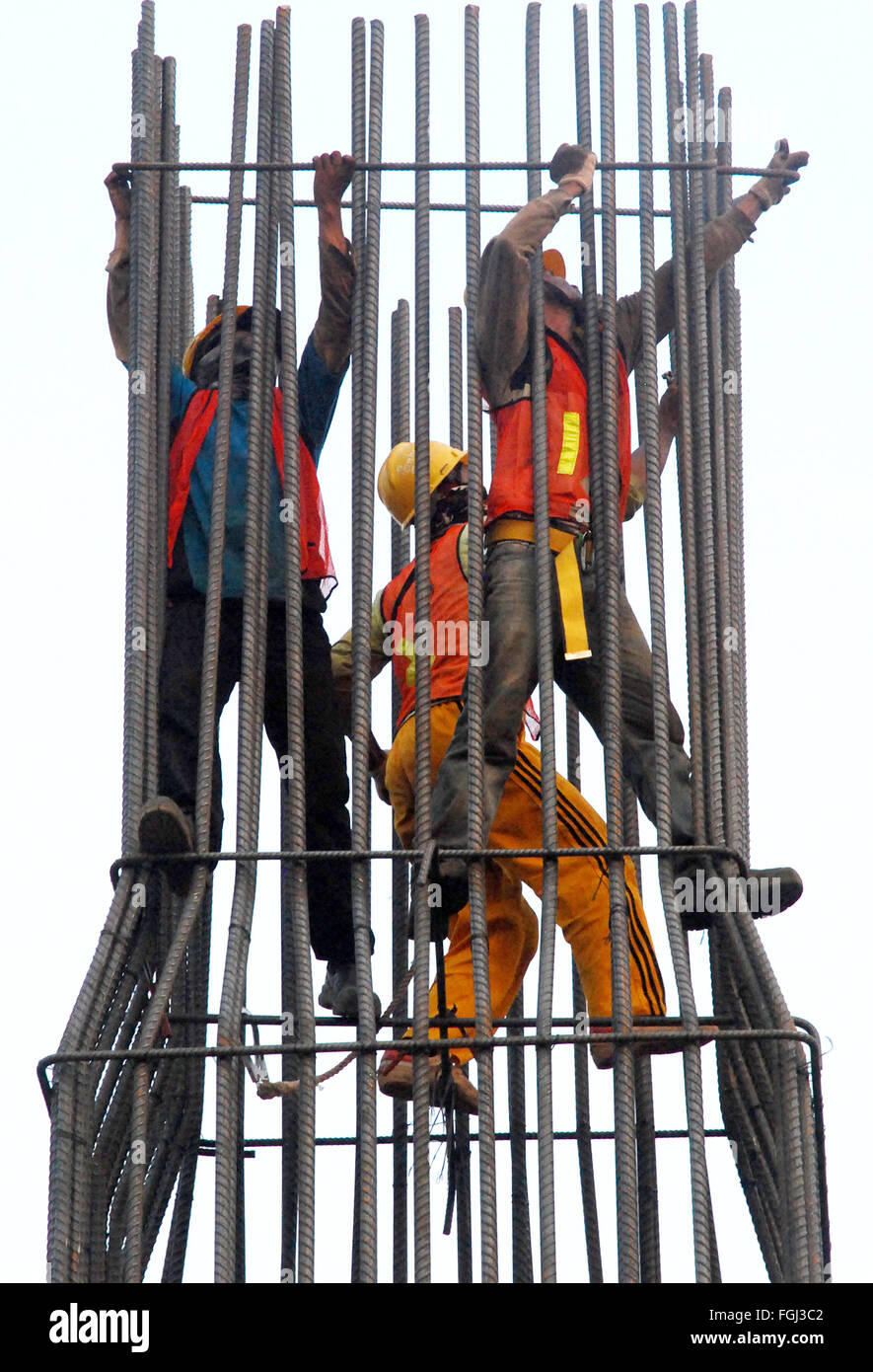 Jakarta, Indonesia. 20th Oct, 2015. Workers complete the flyover region ...
