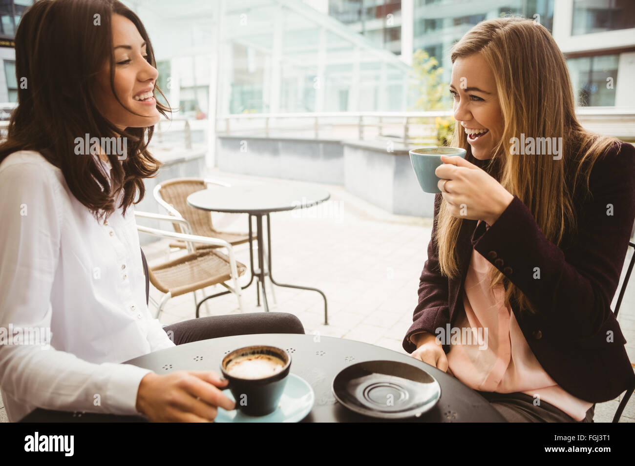 Friends chatting over coffee Stock Photo - Alamy