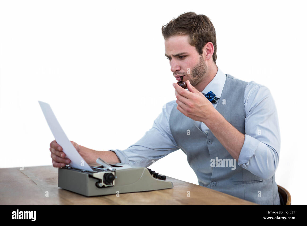 Handsome man using old fashioned typewriter Stock Photo - Alamy