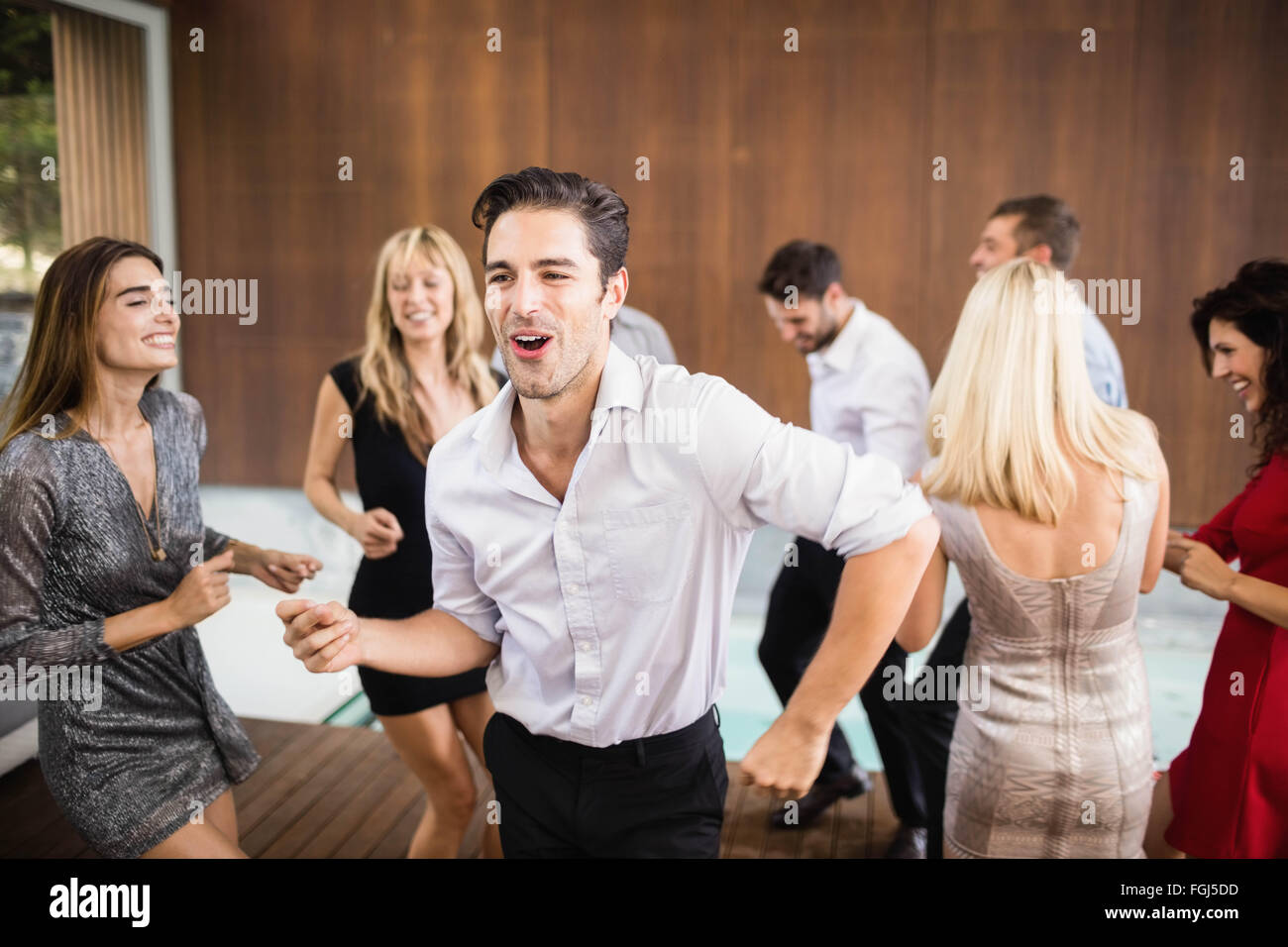 Group of young friends dancing Stock Photo - Alamy