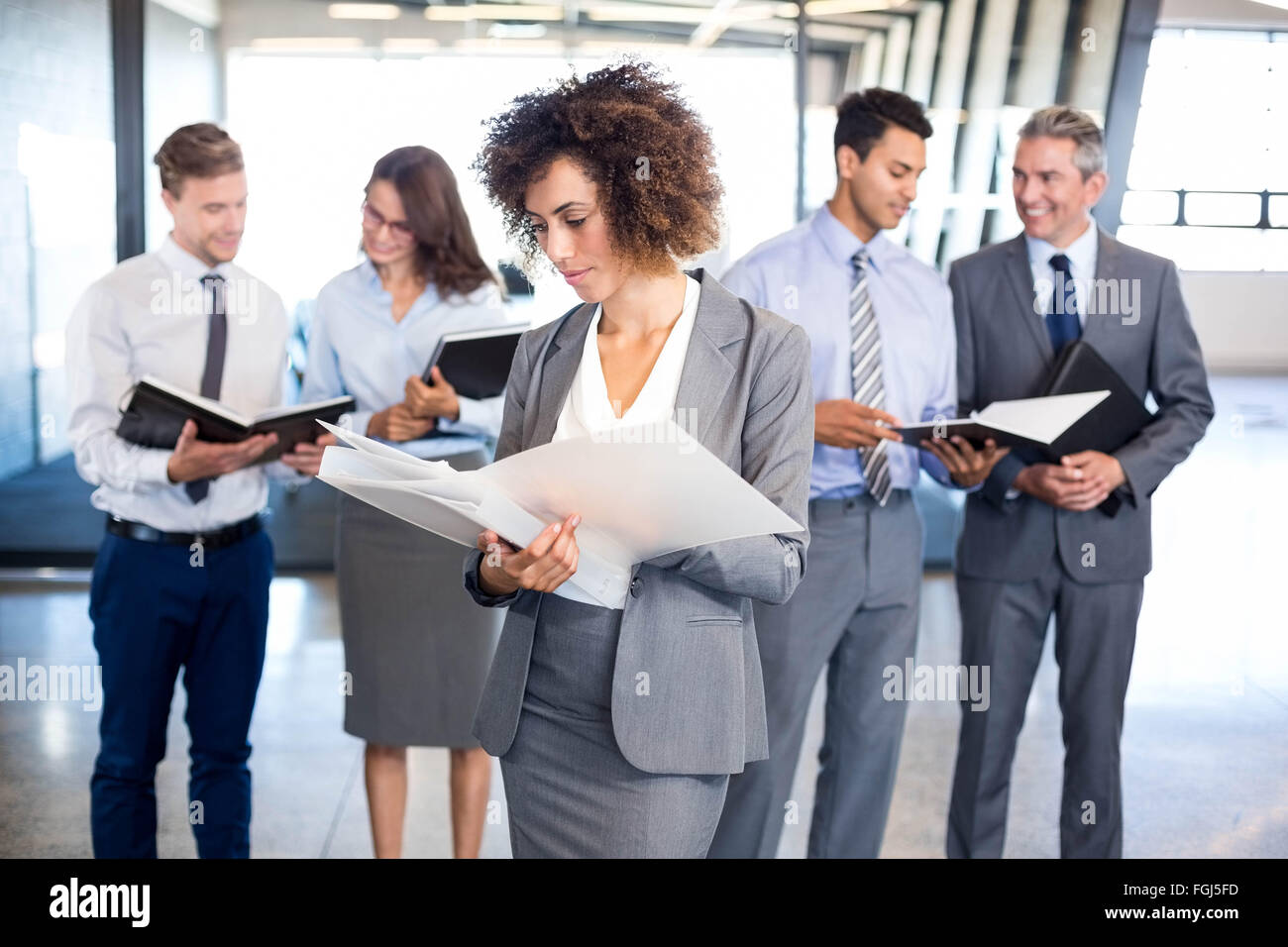 Business team with document and organizer Stock Photo - Alamy