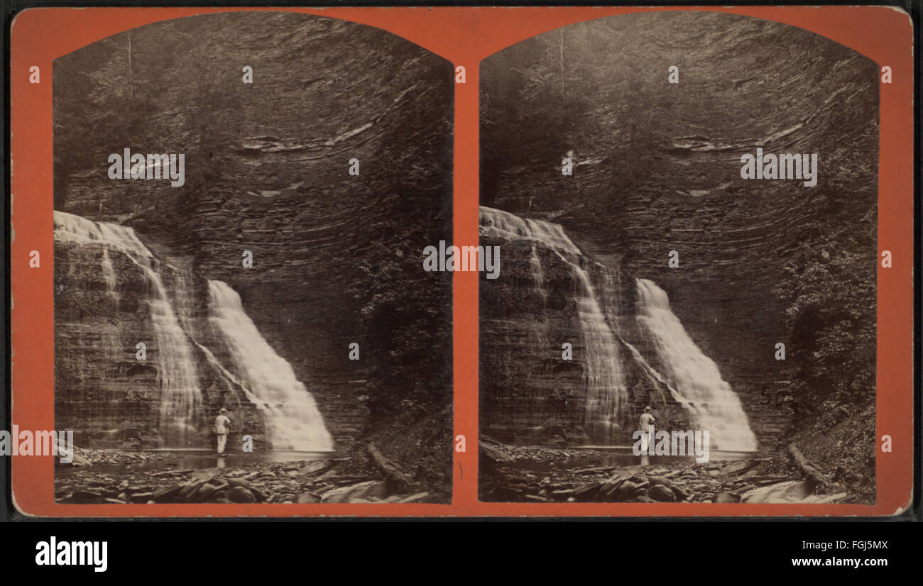 This photograph by D.L. Avery shows a man viewing a waterfall ...