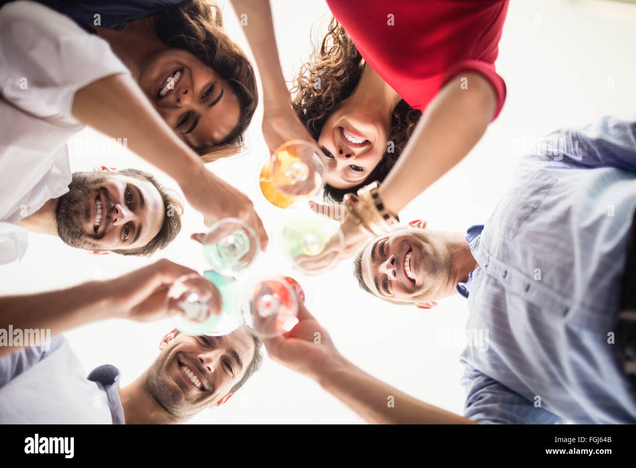 Group of friends having cocktail Stock Photo - Alamy