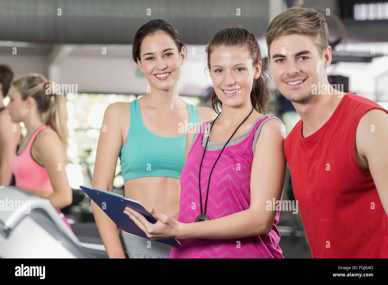 Female trainer showing timer hi-res stock photography and images - Alamy