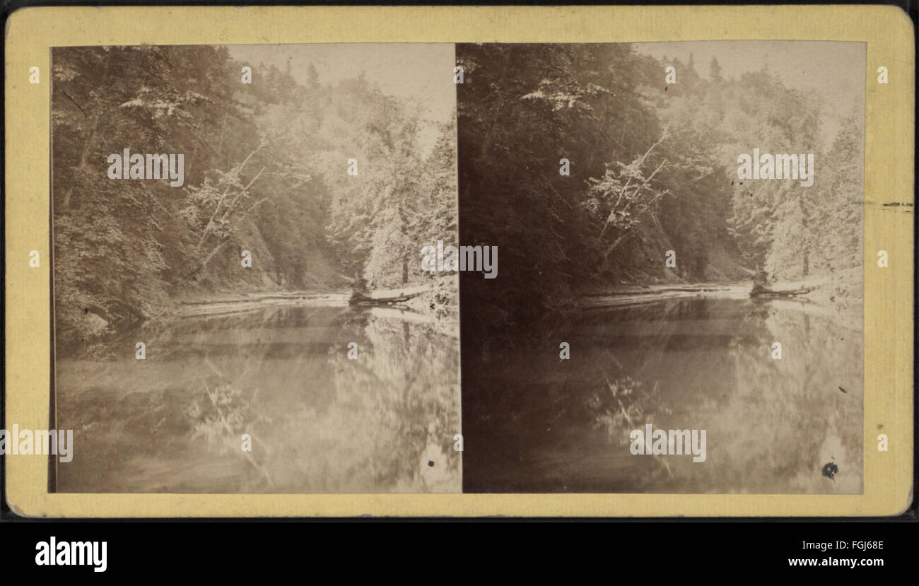 A photograph by C. M. Marsh featuring a mirror-like reflection of the ...