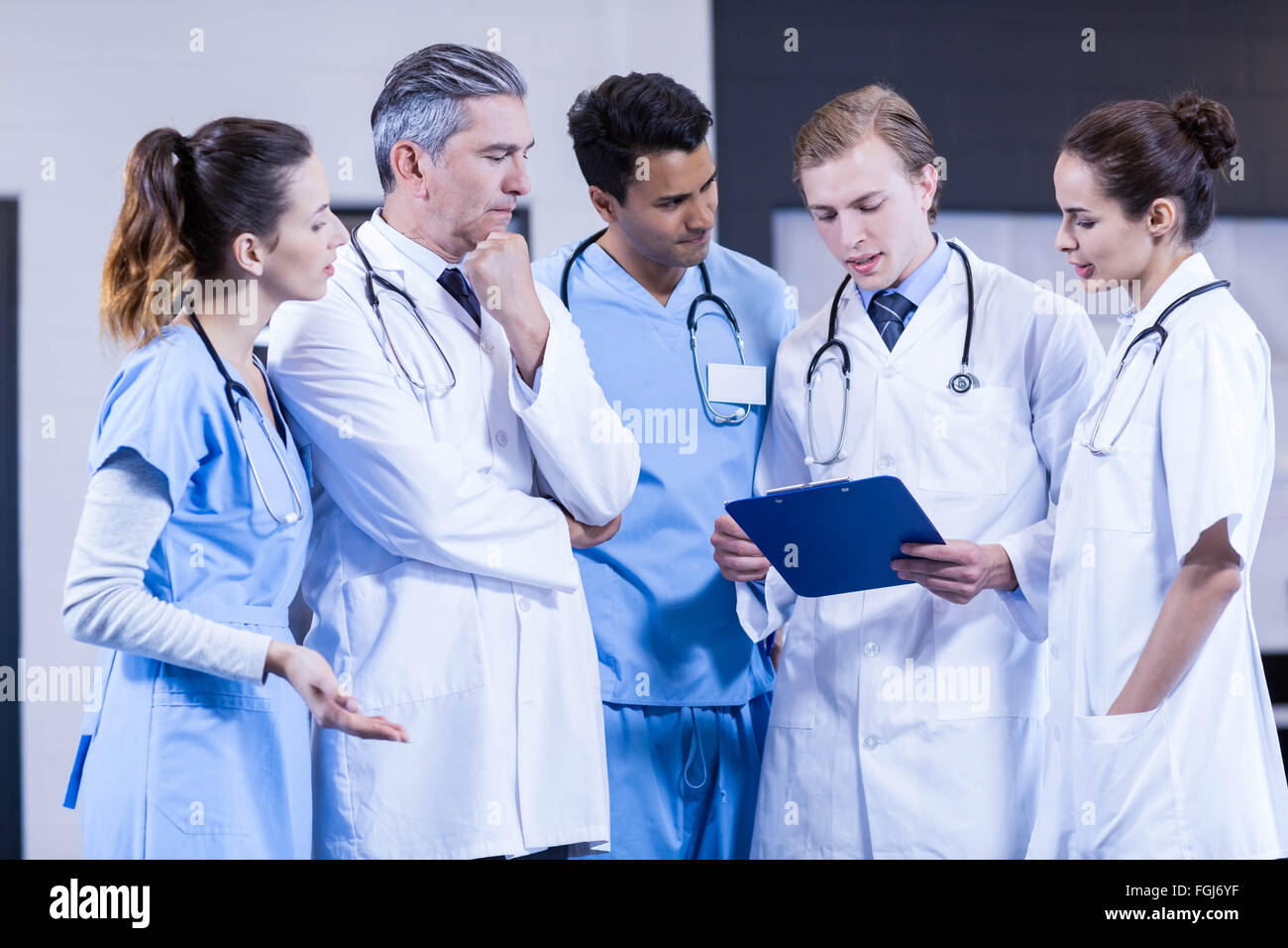 Medical team discussing together Stock Photo - Alamy