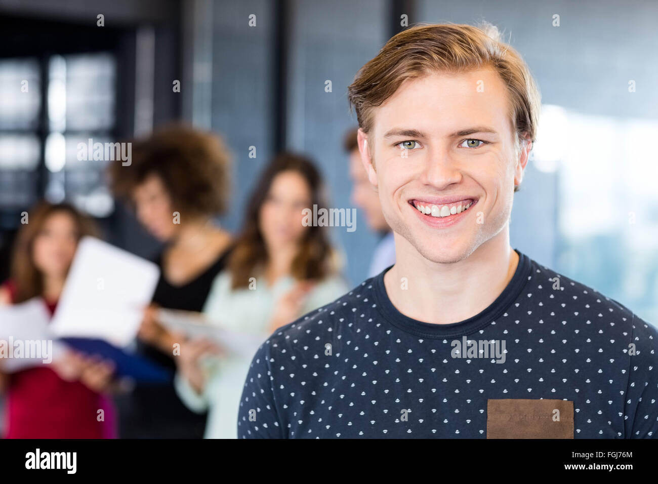 Portrait of man smiling in office Stock Photo - Alamy
