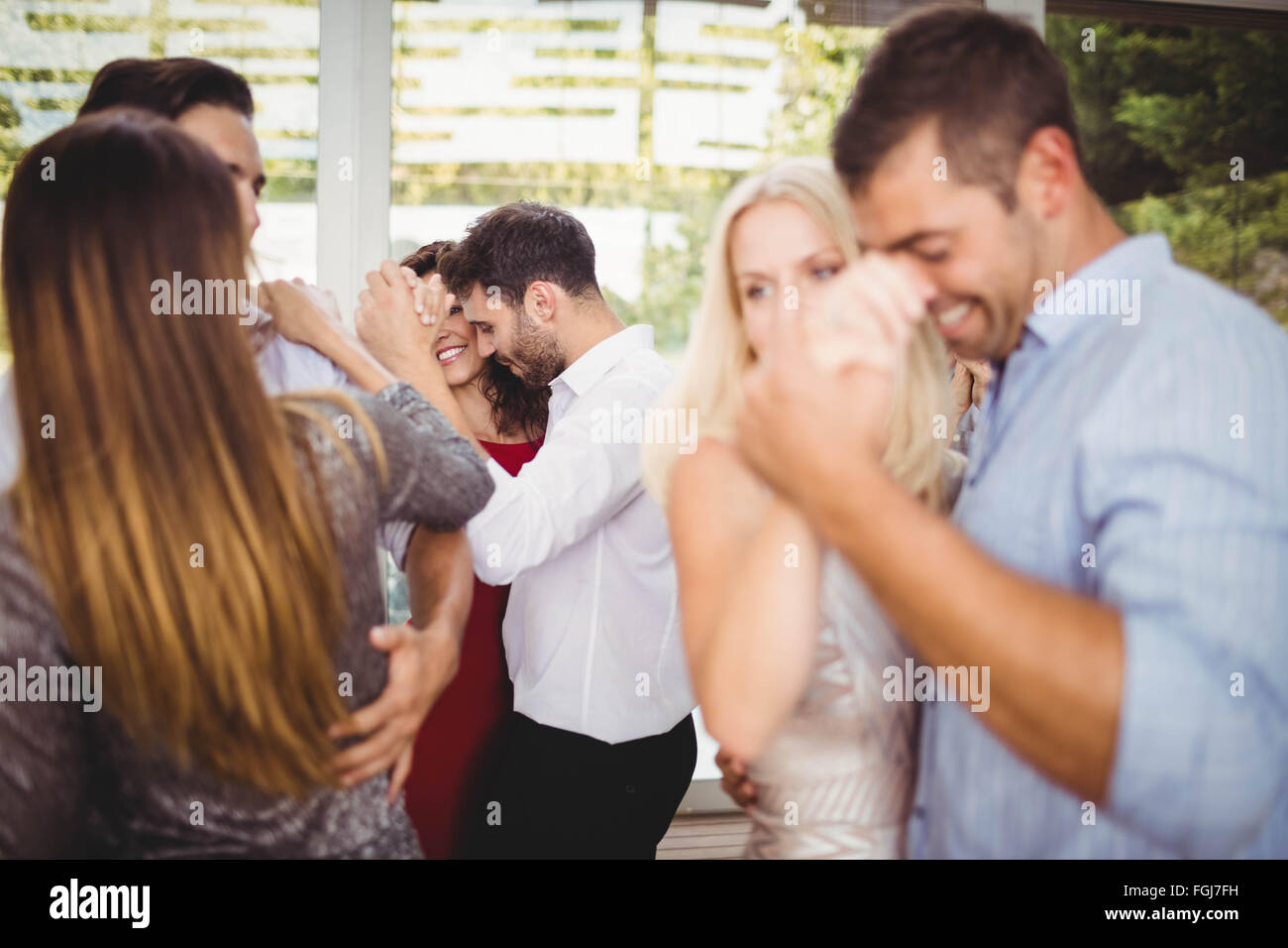 Group of young friends dancing Stock Photo - Alamy