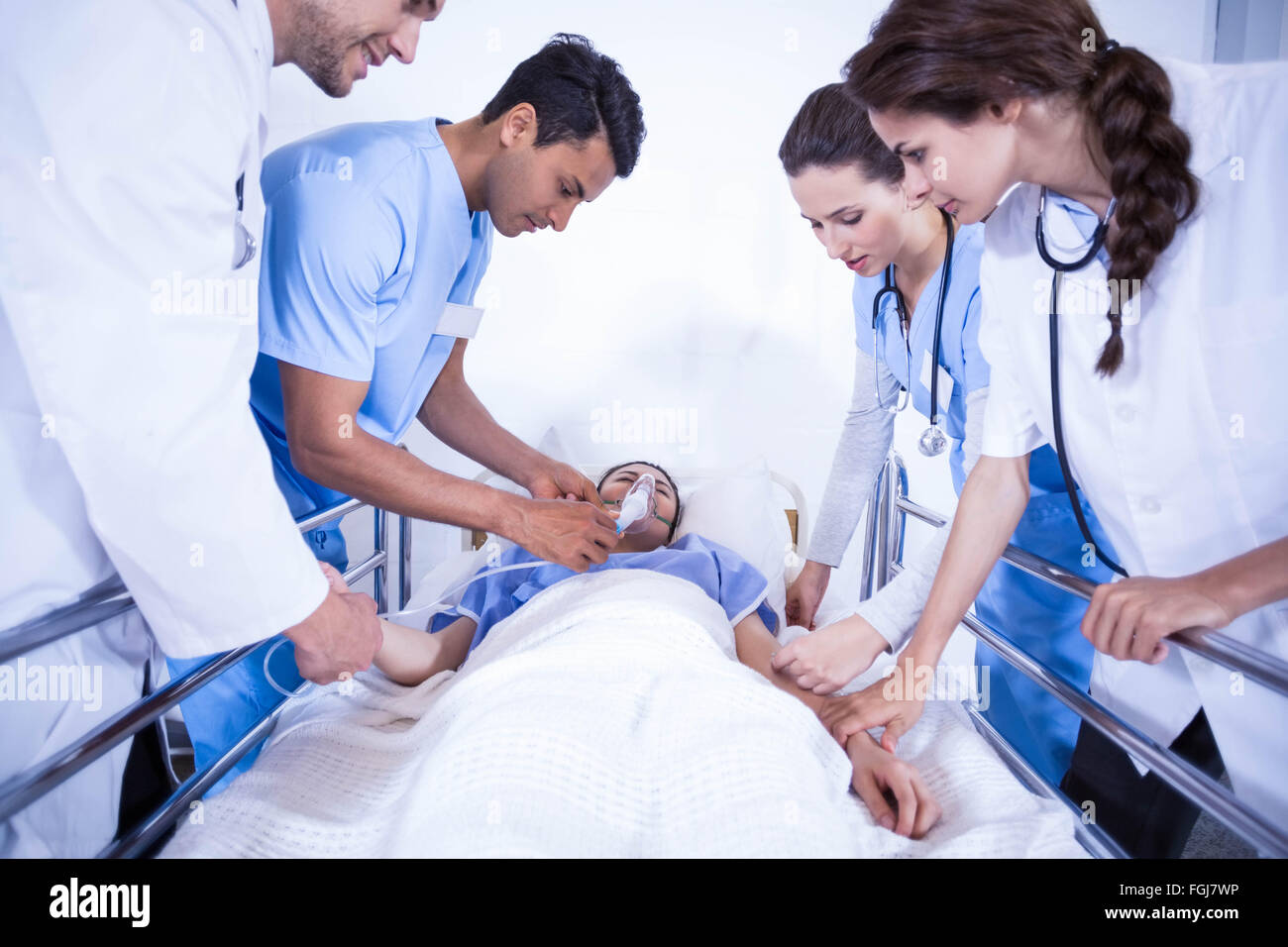 Indian doctor examining female patient with stethoscope hi-res stock ...