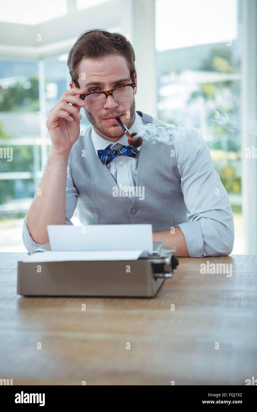 Handsome man using old fashioned typewriter Stock Photo - Alamy