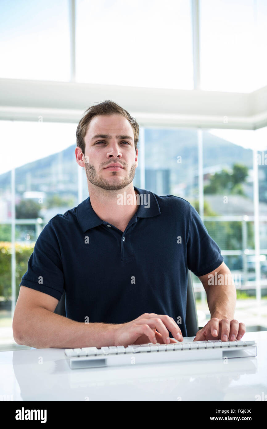 Handsome man using computer Stock Photo - Alamy