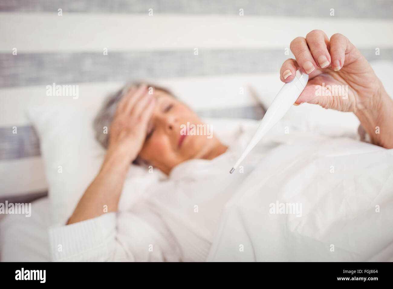 Woman checking temperature hi-res stock photography and images - Alamy
