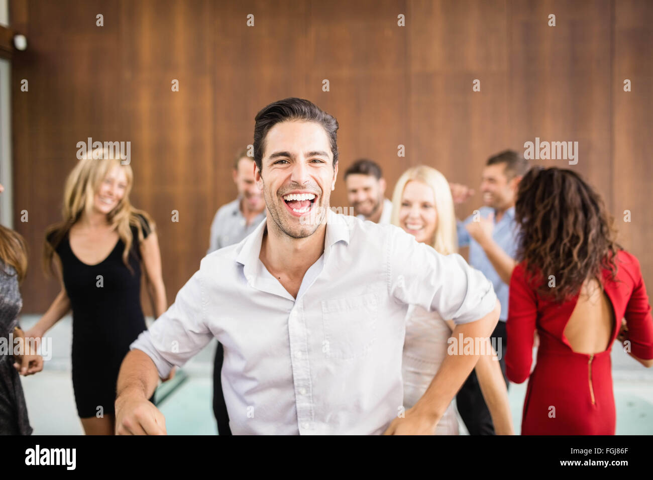 Group of young friends dancing Stock Photo - Alamy