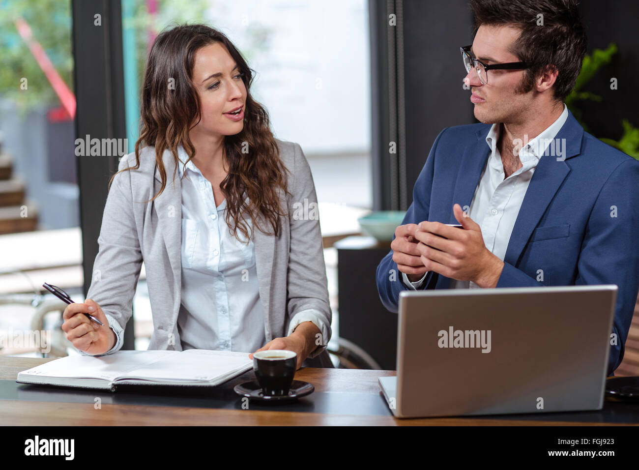 People writing in a notebook Stock Photo - Alamy