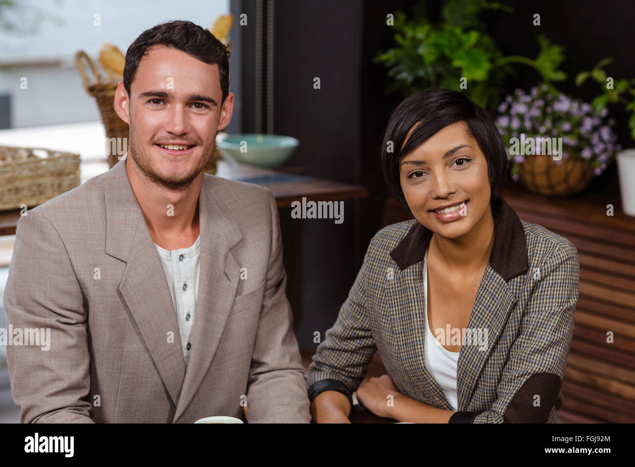 Friends smiling at camera Stock Photo - Alamy