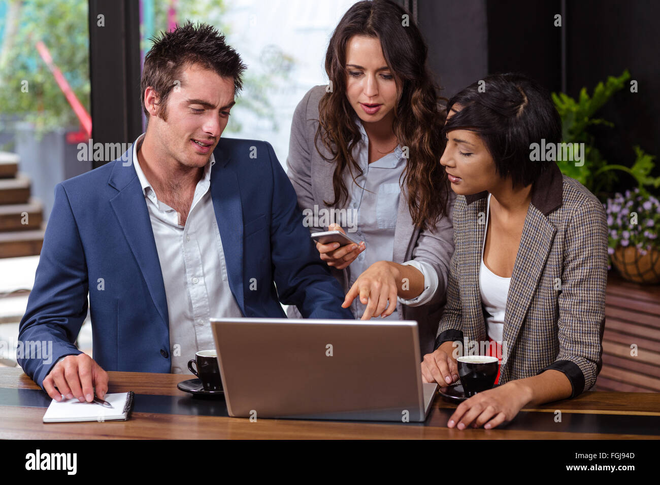 People using technology together Stock Photo - Alamy