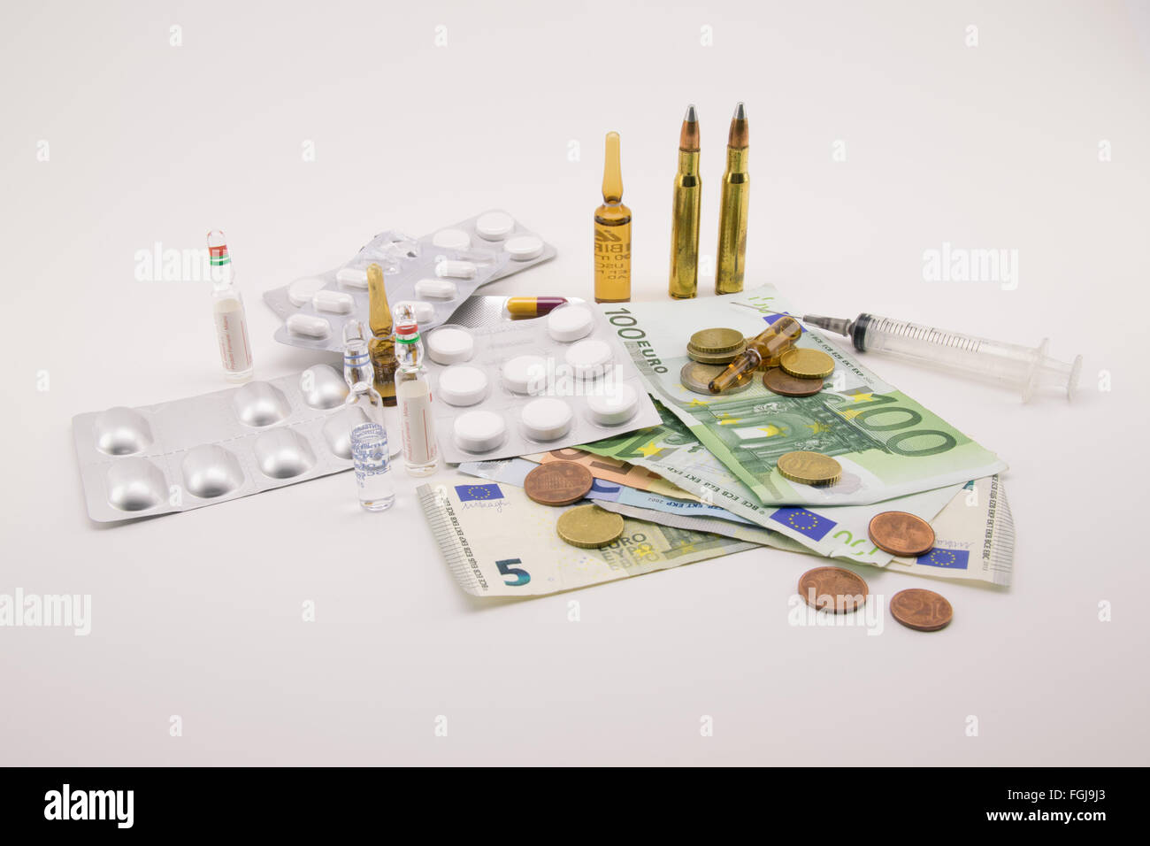 composition with euros, bullets, drugs on white background Stock Photo ...