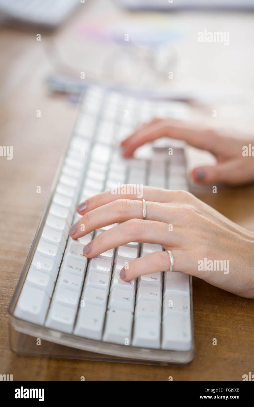 fingers typing on a computer keyboard Stock Photo - Alamy