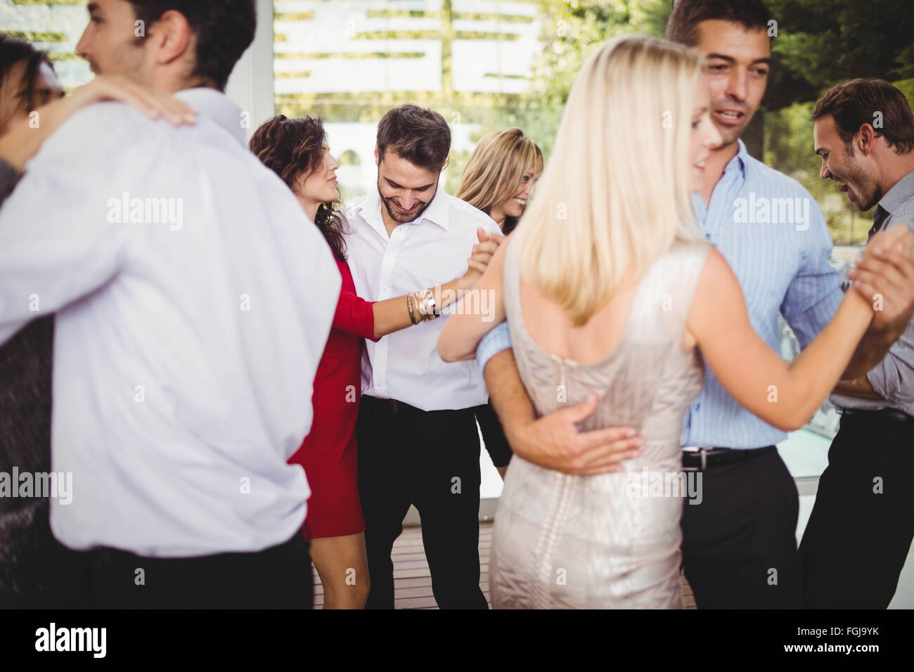 Group of young friends dancing Stock Photo - Alamy