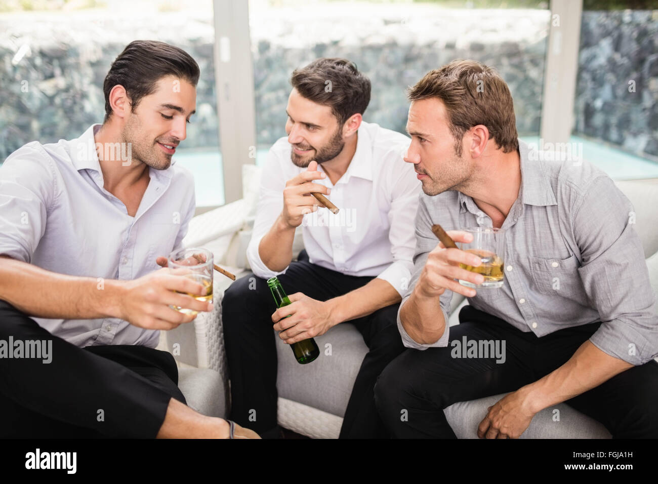 Group of men discussing Stock Photo - Alamy