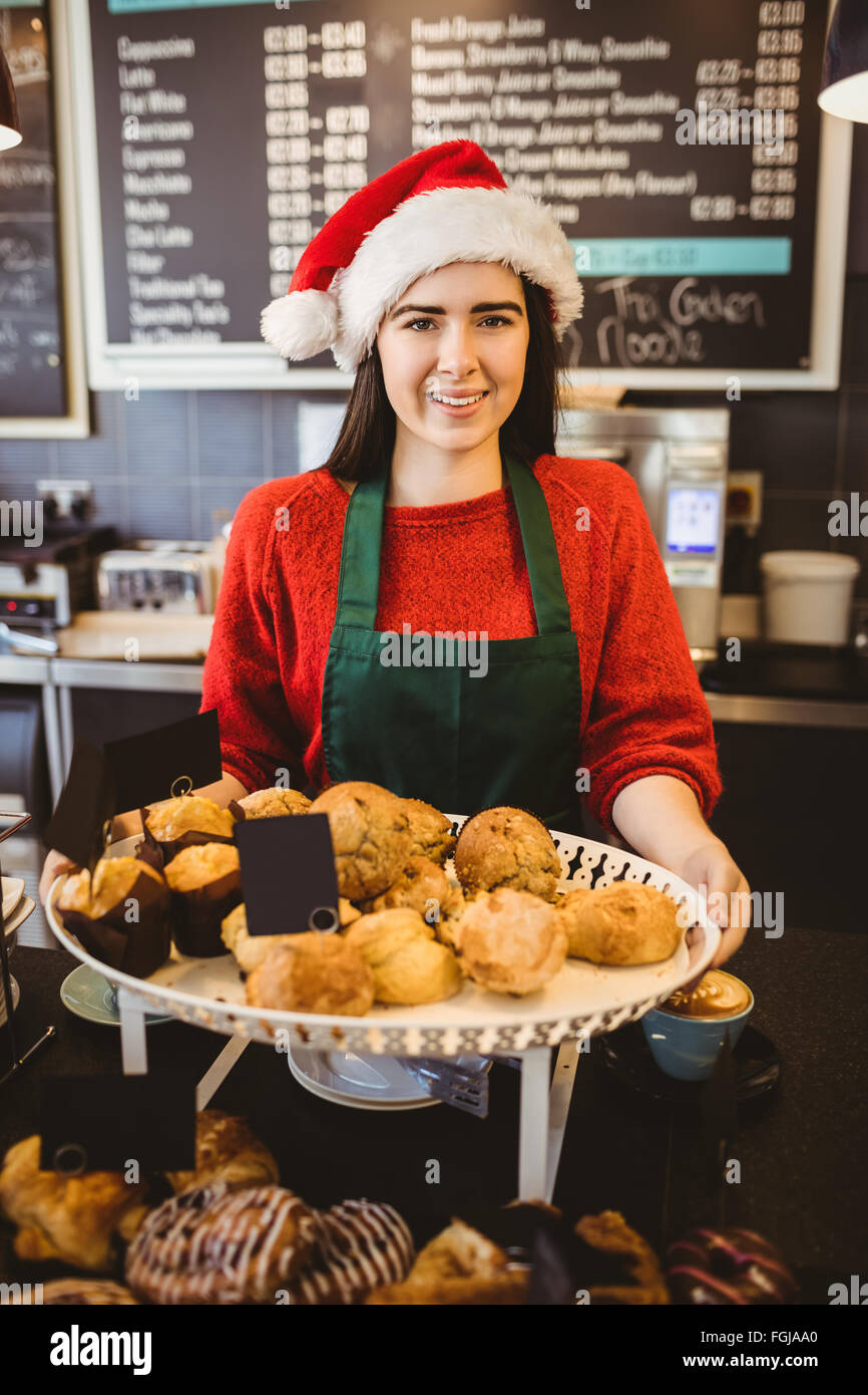 Cute waitress standing behind the counter Stock Photo - Alamy