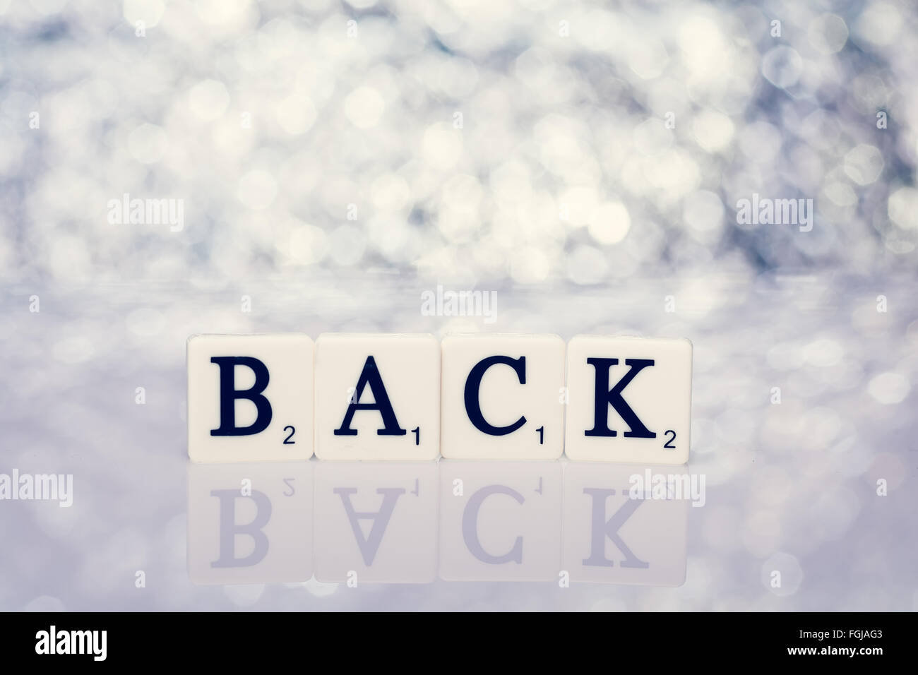 Written word tiles with letters from the game Scrabble - back Stock ...