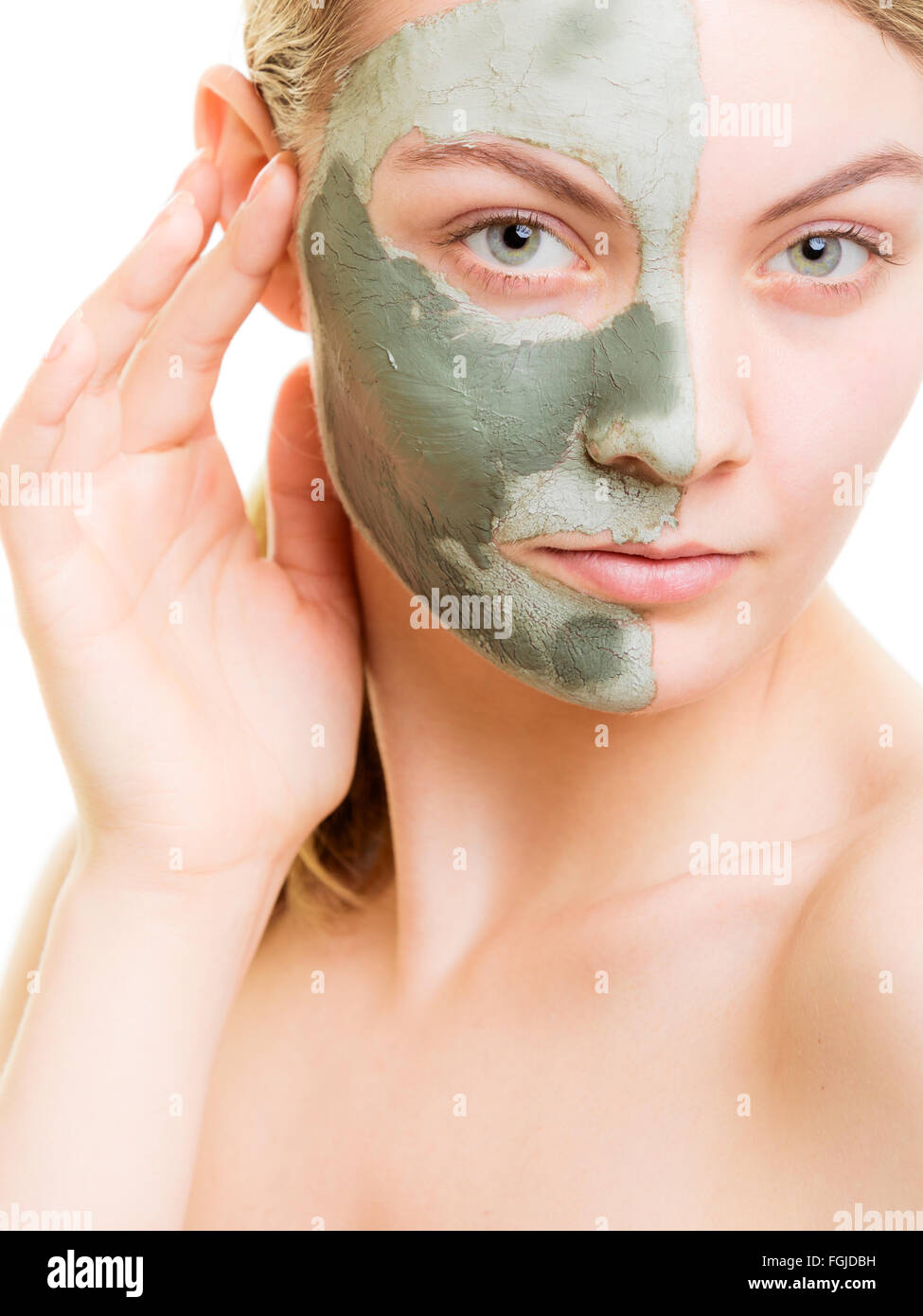 Skin care. Woman in clay mud mask on face isolated on white. Girl ...