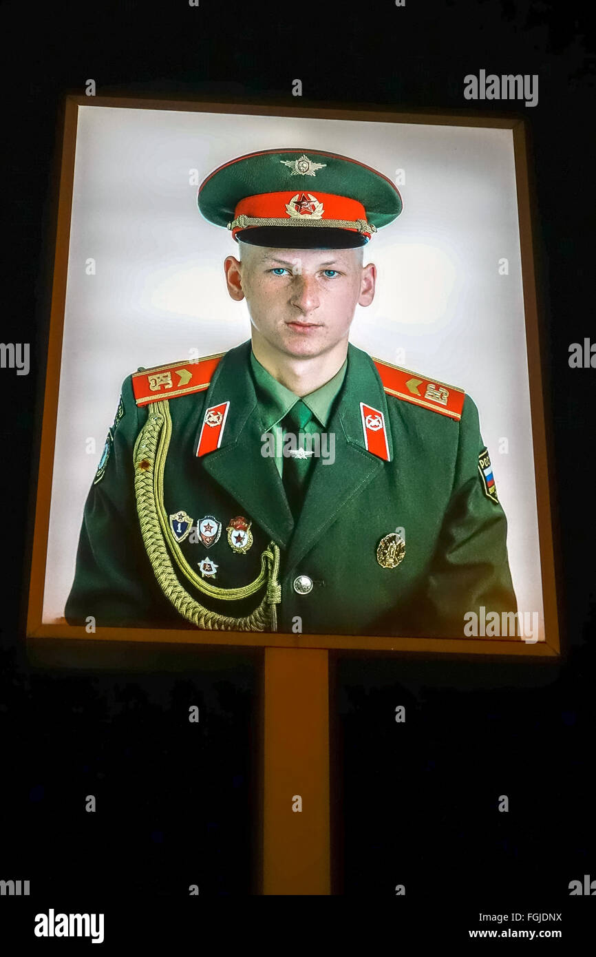 Illuminated photograph of a Soviet soldier at Checkpoint Charlie in ...