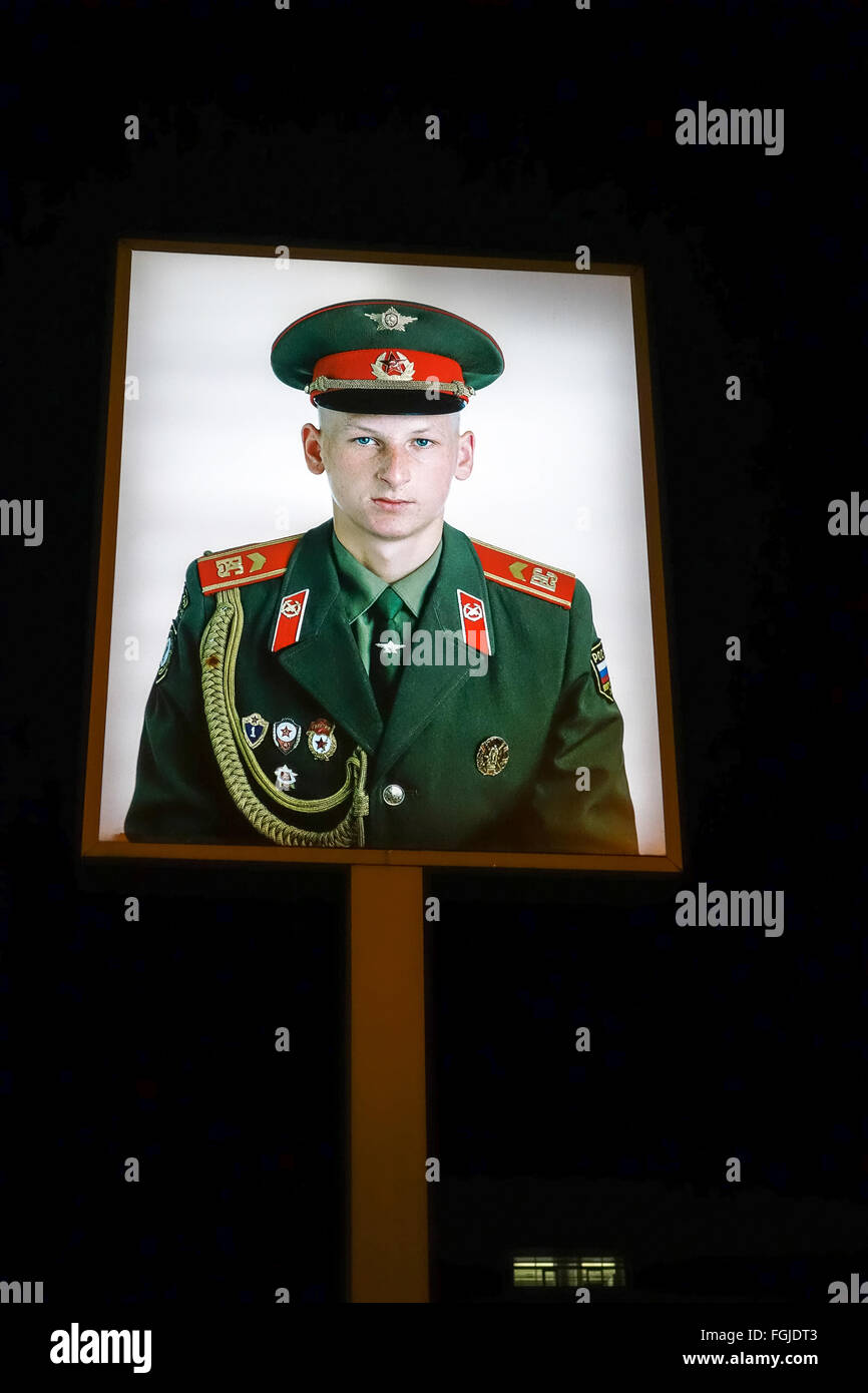Illuminated photograph of a Soviet soldier at Checkpoint Charlie in ...