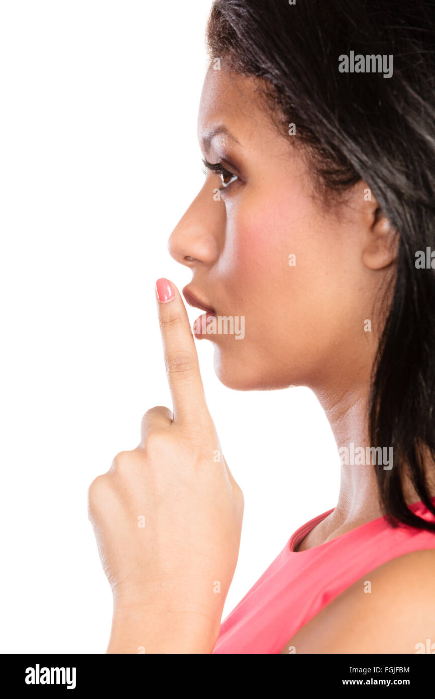 Young mixed race woman girl with finger on lips showing hand quiet ...
