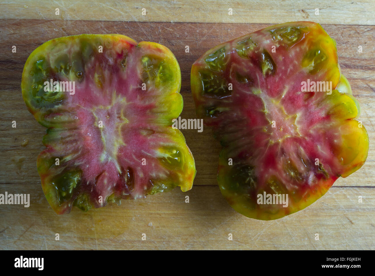 Heirloom tomato cut in half hi-res stock photography and images - Alamy