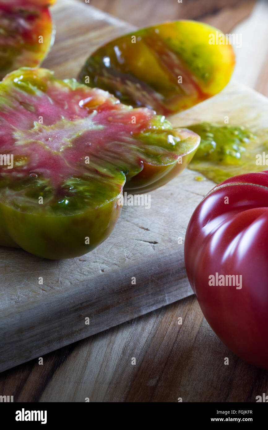 beautiful flavorful tomato cut in half with a colorful pattern and ...