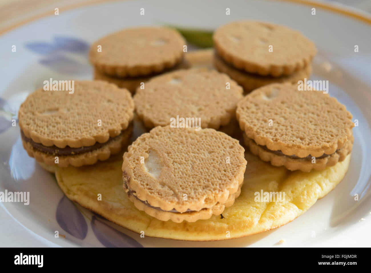 Sandwich biscuits with chocolate filling on a white background Stock ...
