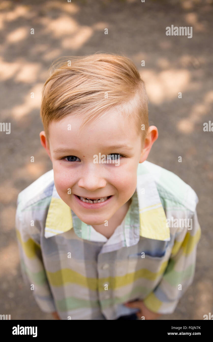 Young boy outdoors in a lifestyle portrait with natural light Stock ...