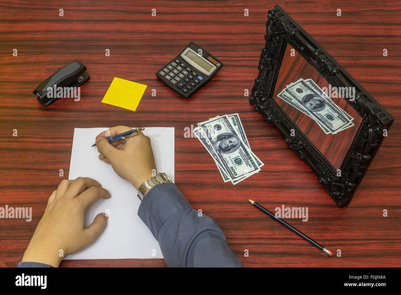 Sheet of paper with printed graphs on a desk with pen, pencil and ...