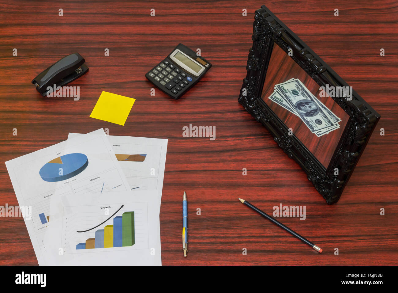 Reflection of money in the mirror. Both objects are surrounded by ...
