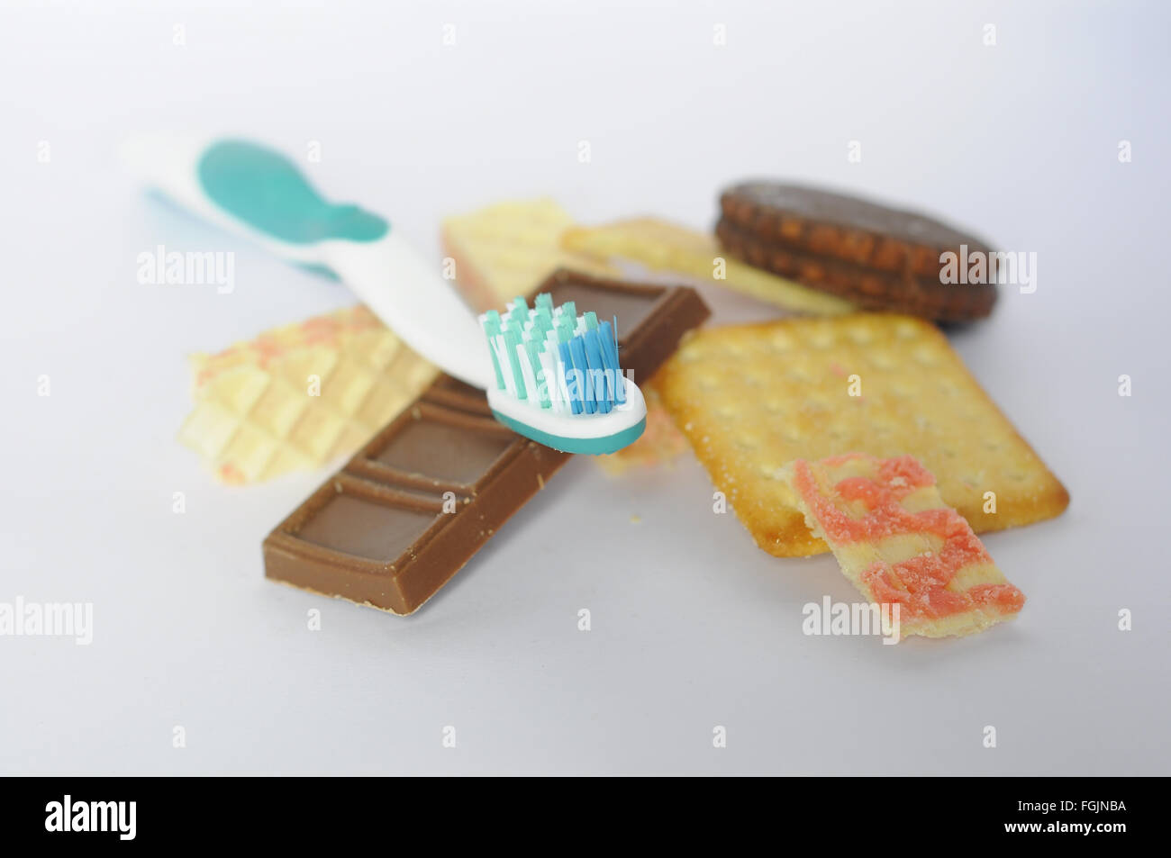 biscuits and chocolate with toothbrush Stock Photo - Alamy