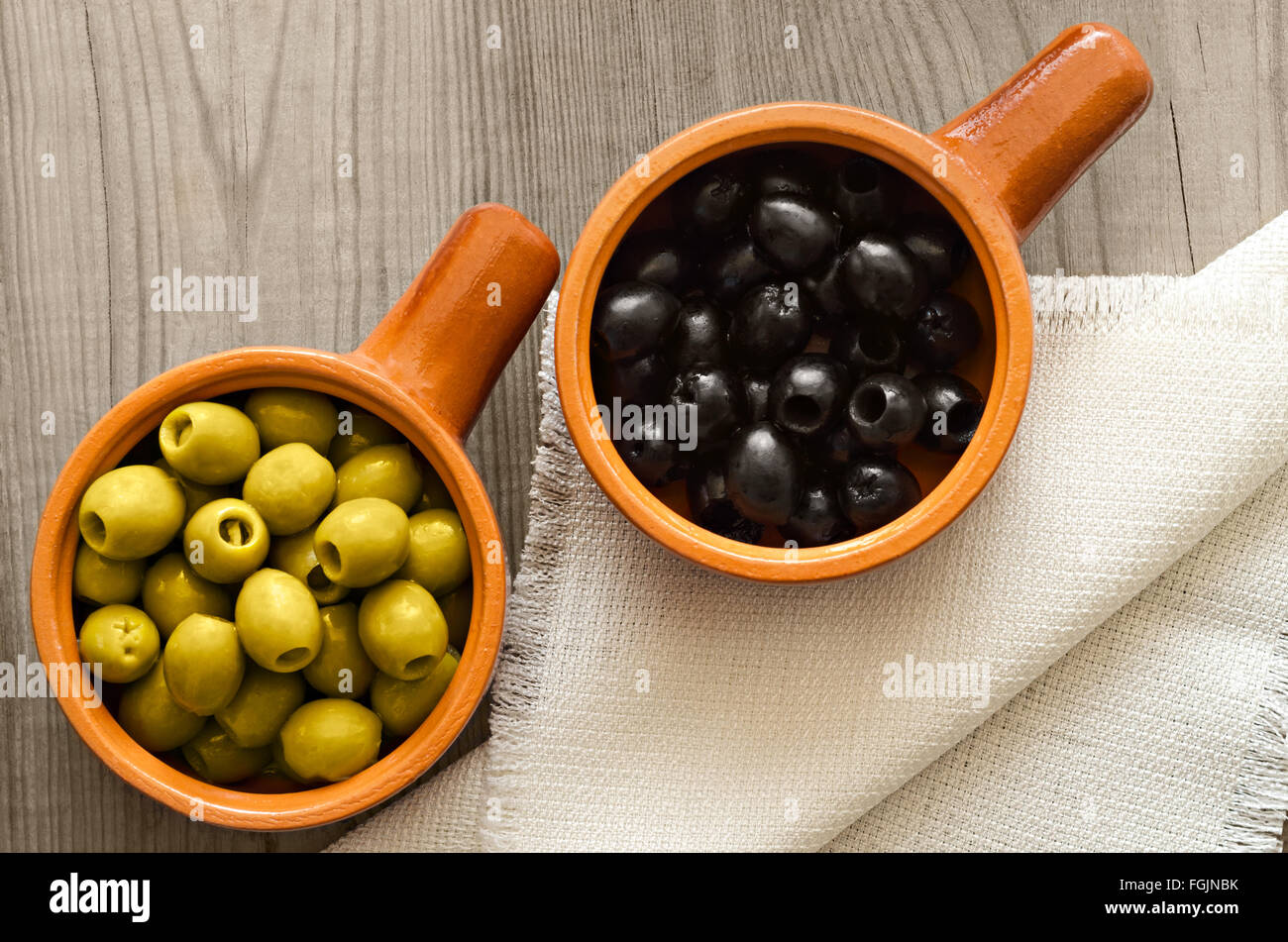 Olives in ceramic cups on the table Stock Photo - Alamy